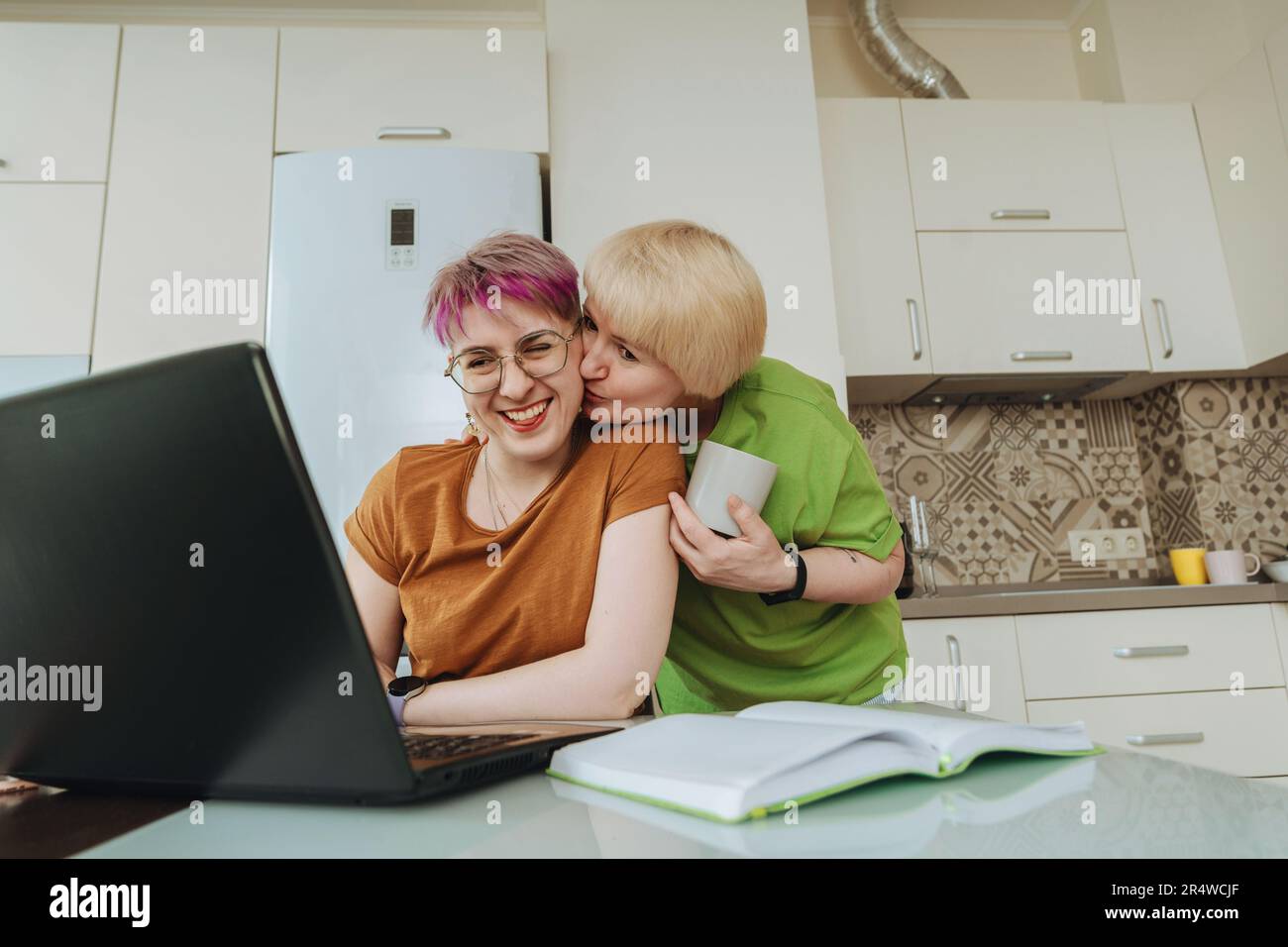 Woman kisses computer hi-res stock photography and images - Alamy