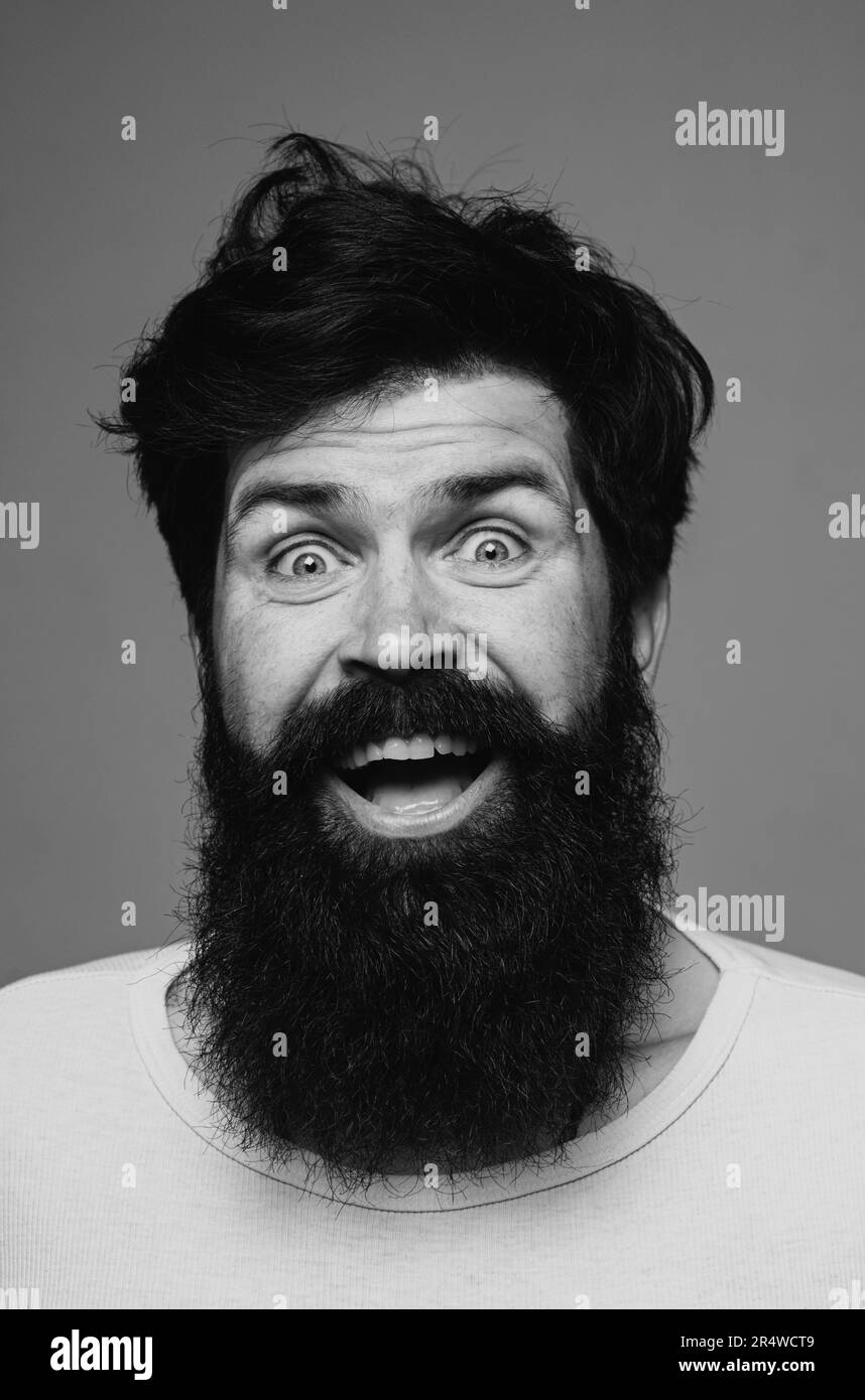 Excitedc Handsome young guy. Portrait of satisfied businessman against ...