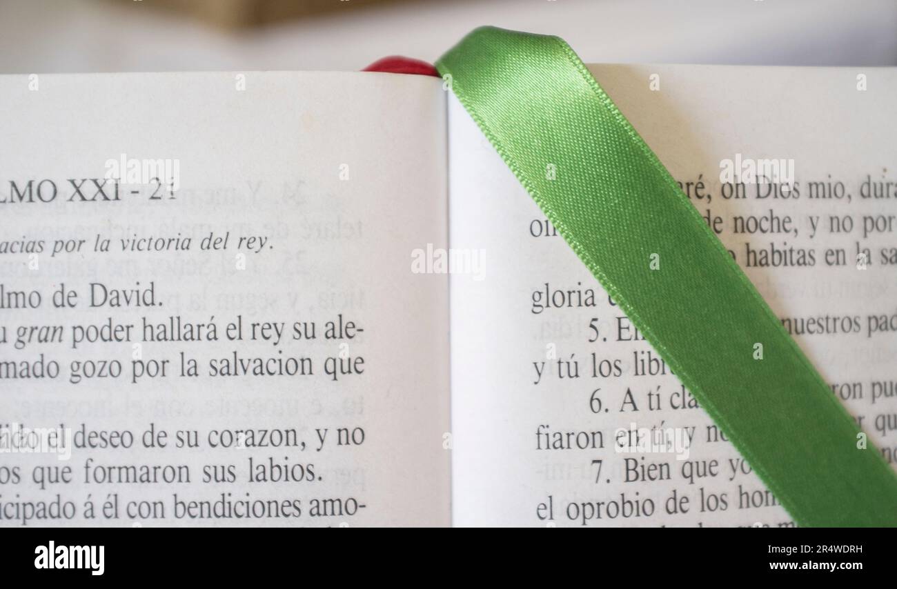 Open Bible at The Book of Psalms. Green bound bookmark over the page ...