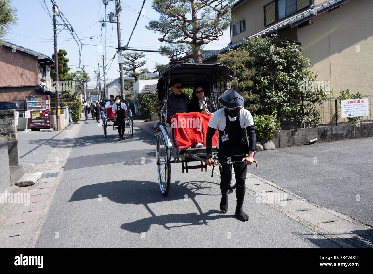 March 7, 2023, Kyoto, Japan: Tourists getting a rickshaw ride to ...