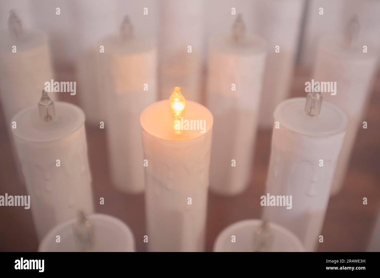 Flameless electric candles. Focus on the only light on Stock Photo - Alamy
