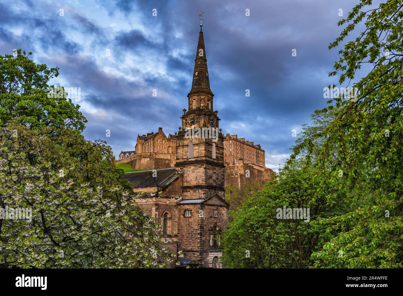 Church of St Cuthbert tower and Edinburgh Castle in city of Edinburgh ...
