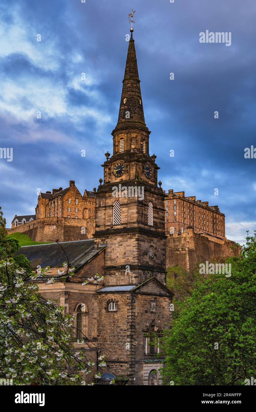 Church of St Cuthbert tower and Edinburgh Castle in city of Edinburgh ...