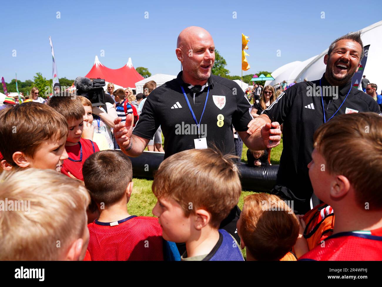 Wales manager Rob Page speaks to children following the Wales Squad ...