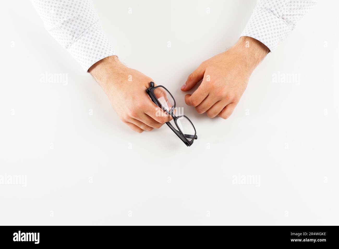 Glasses in hand Stock Photo - Alamy
