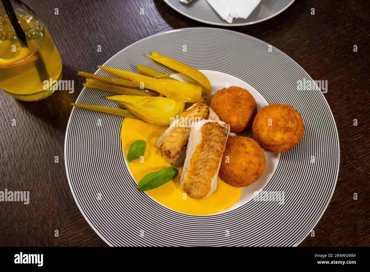 Fillet from fish cod, polenta croquet in carrot and orange purre ...