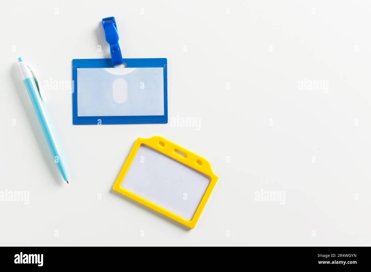 Name tag and a pen Stock Photo - Alamy