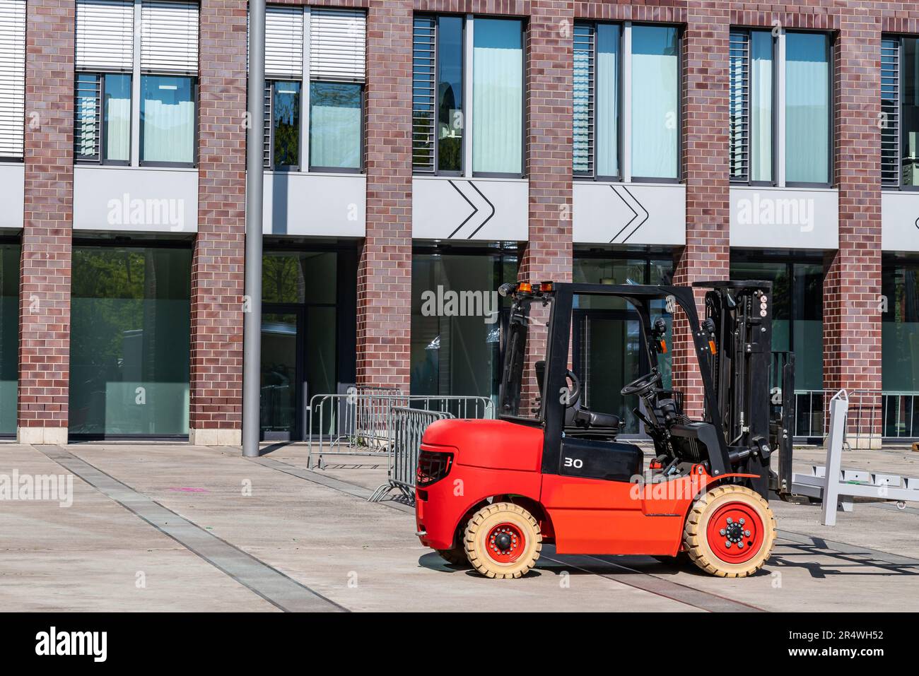 Forklift at a construction site against the backdrop of a large ...