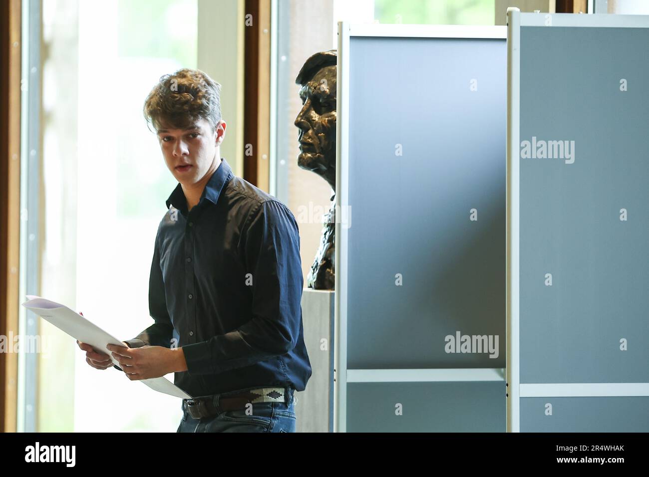 ASSEN - Member of Parliament Bjorn Schutte (18 years old, BBB) casts a ...