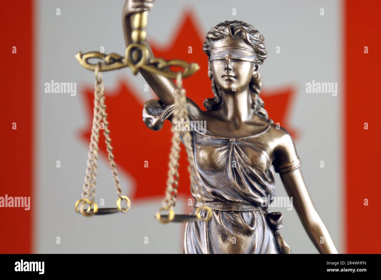 Symbol of law and justice with Canada Flag. Close up Stock Photo - Alamy