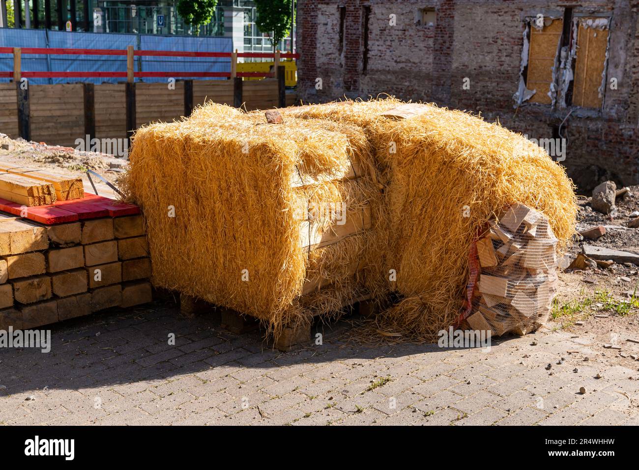Wood fiber insulation and wooden bars stacked in bales at a ...