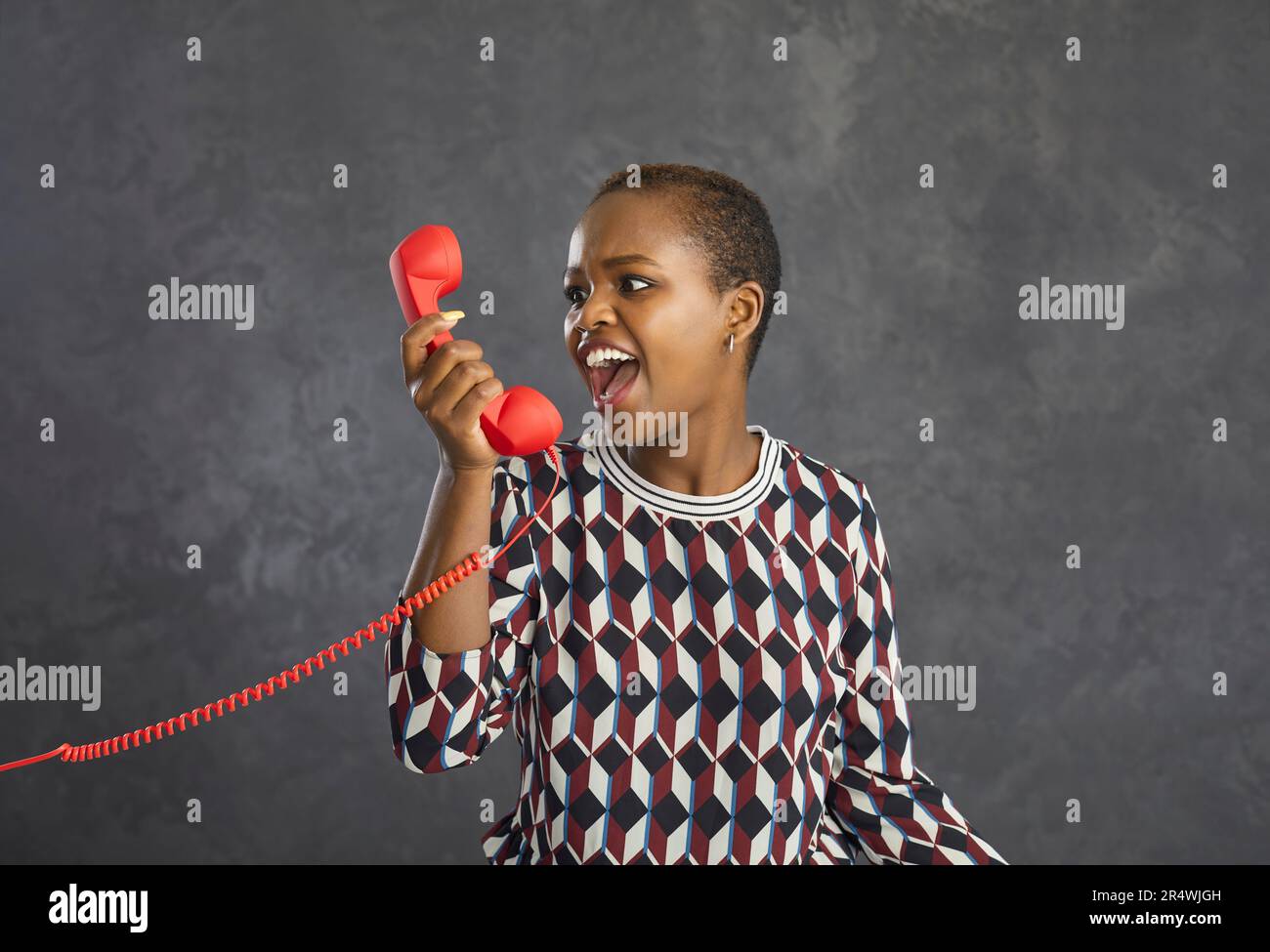 African american woman irritated and angrily shouting into the phone ...