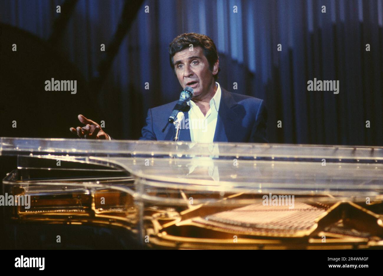 French singer Gilbert Bécaud on stage, c.1989 Stock Photo - Alamy
