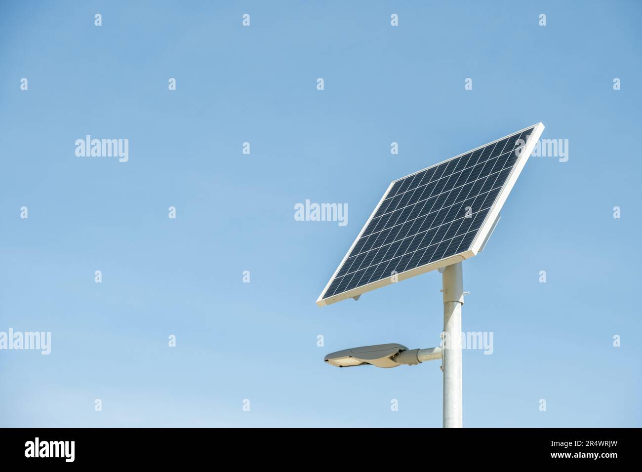 Public city light with solar panel in city. Street lamp post with solar ...