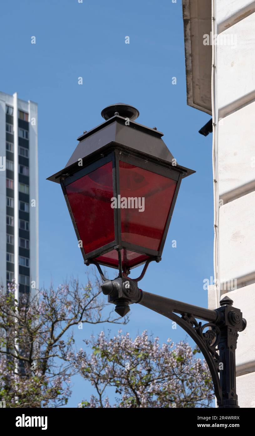 A red street lamp along a stone wall Stock Photo - Alamy