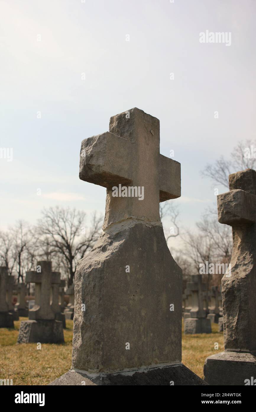 Simple plain stone cross standing in the sunny cemetery Stock Photo - Alamy