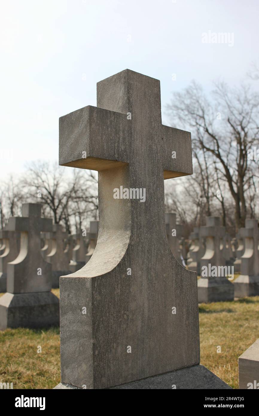 Simple plain stone cross standing in the sunny cemetery Stock Photo - Alamy