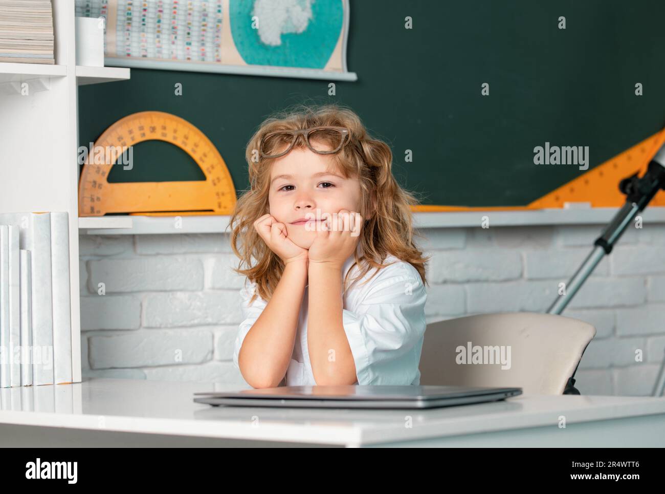 Smart cute boy thinking math hi-res stock photography and images - Alamy