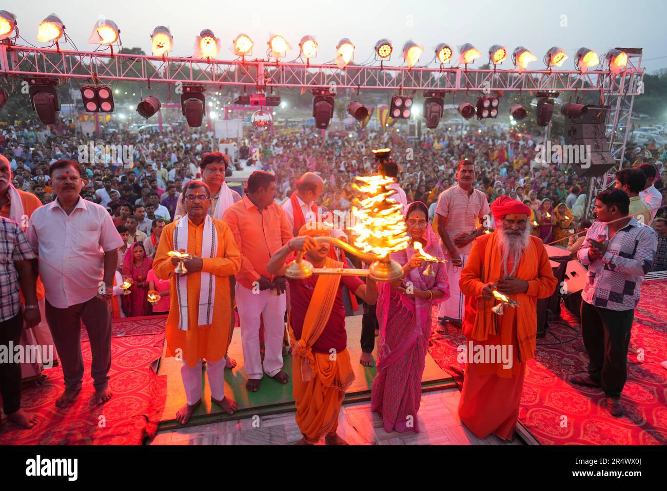 Hindu priests perform evening rituals at the Sangam, the confluence of ...