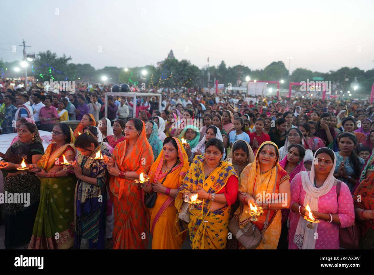 Hindu devotees perform evening rituals at Sangam, the confluence of the ...