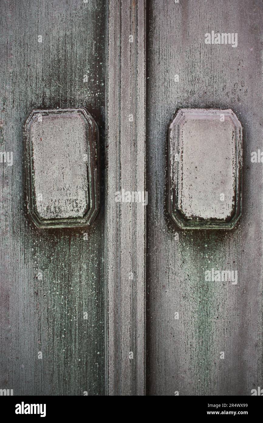 Two antique panels decorating a copper metal wall Stock Photo - Alamy