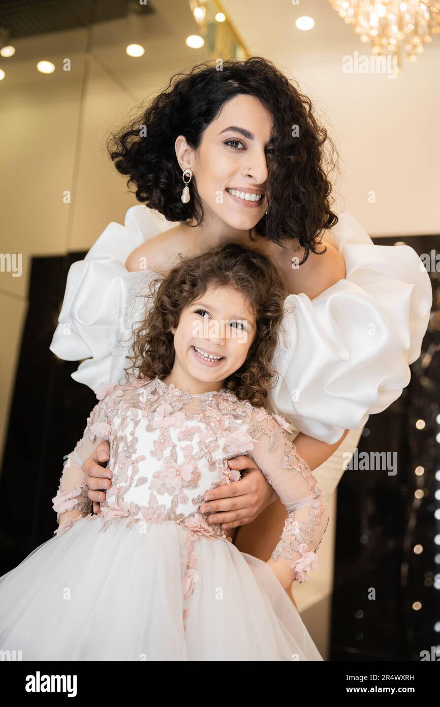 gorgeous middle eastern bride with brunette hair standing in white ...