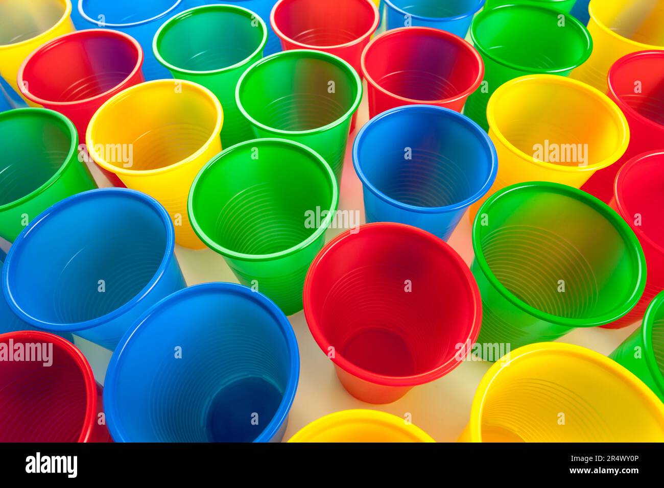 Multicolor plastic glasses isolated on white background Stock Photo - Alamy