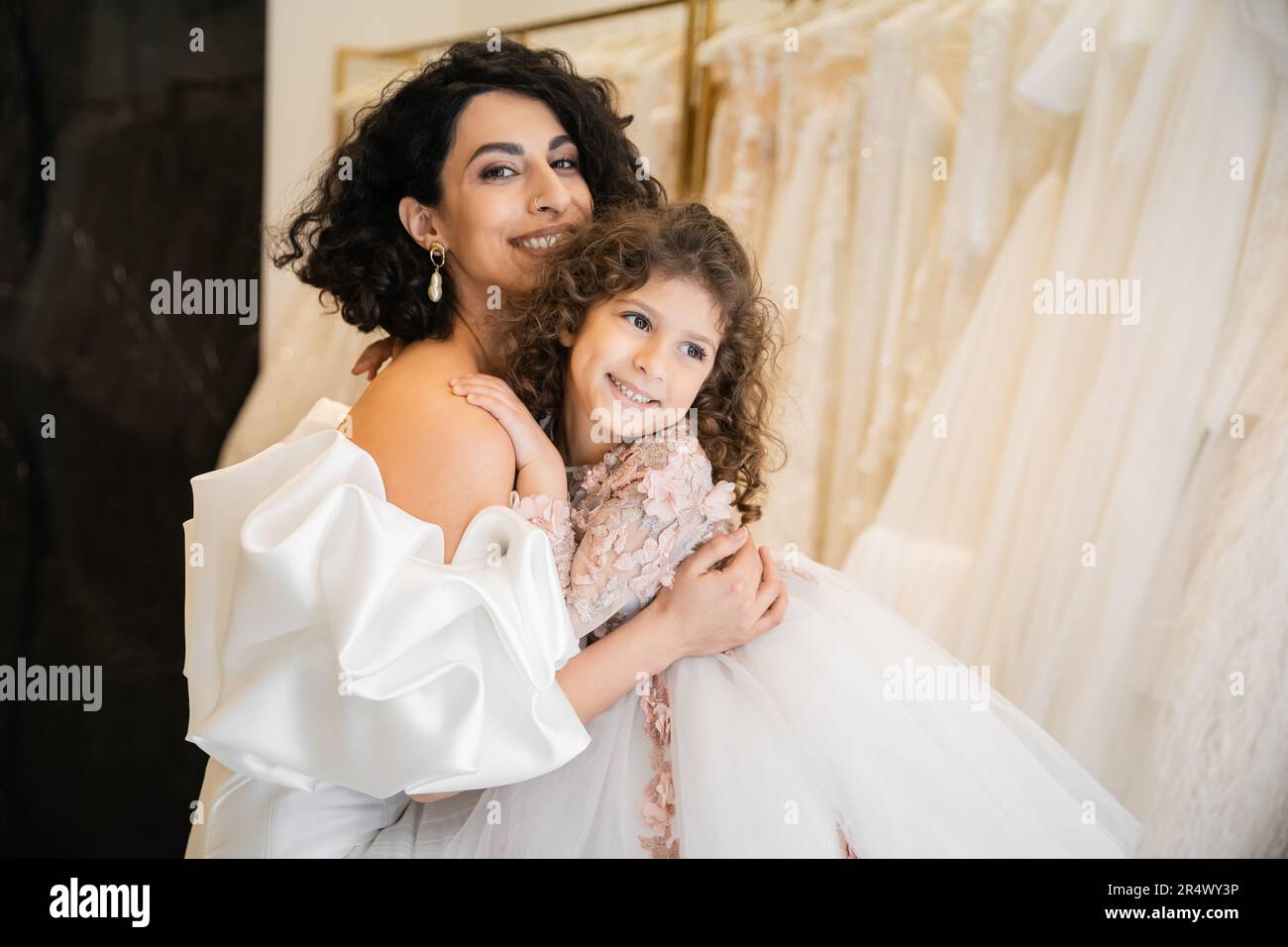 charming middle eastern bride with brunette hair in white wedding dress ...