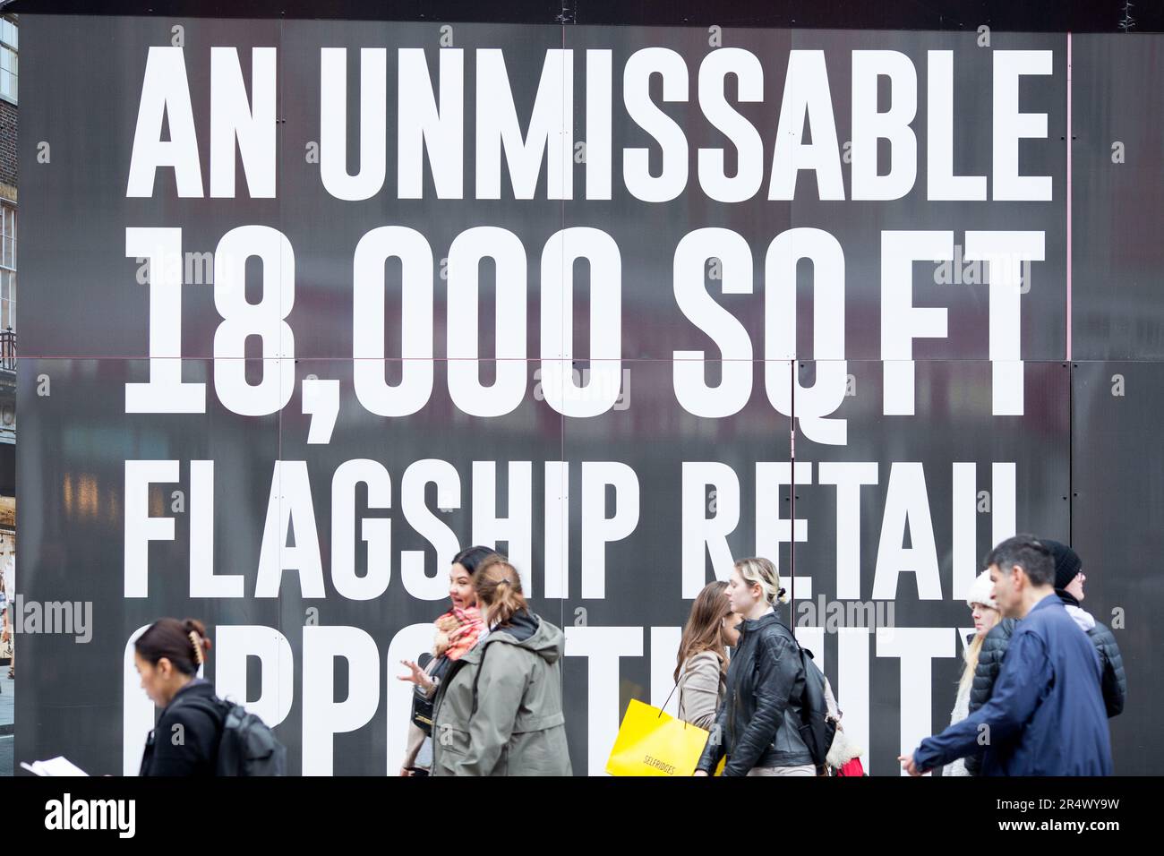 Pedestrians walk past an advertising message in London Stock Photo - Alamy Pedestrians walk past an advertising message in London Stock Photo - Alamy