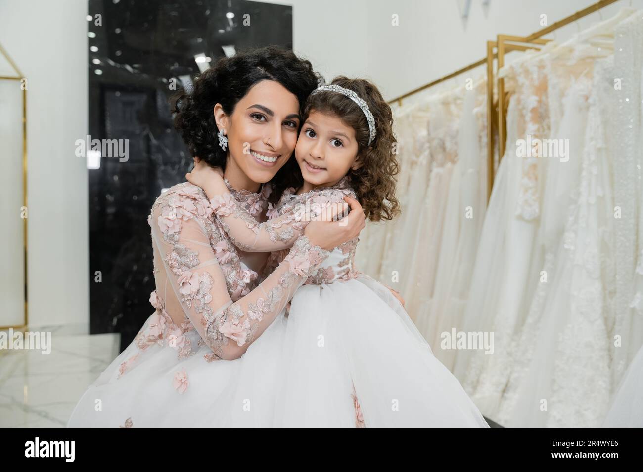 brunette middle eastern woman with wavy hair in stunning wedding dress ...