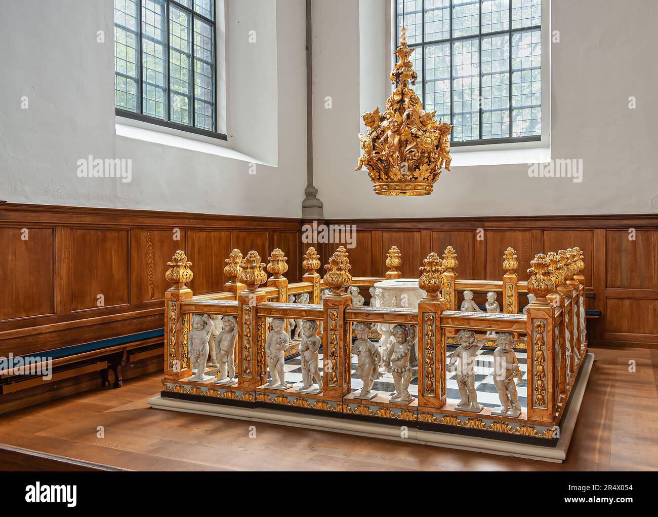 Copenhagen, Denmark - September 14, 2010: Baptismal font in corner with ...