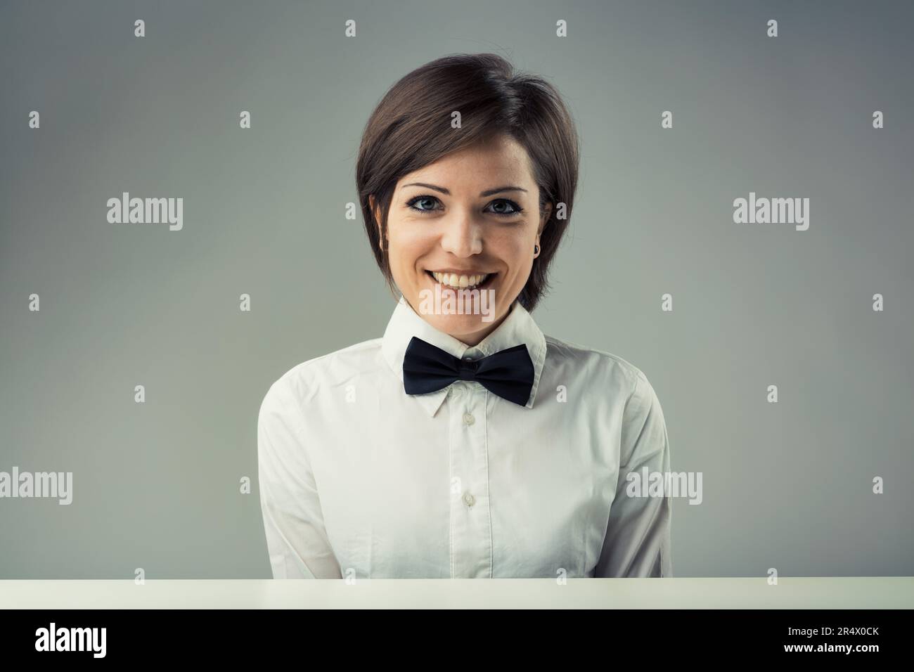 Enthusiastic vintage presenter from the '70s. White shirt, bowtie ...