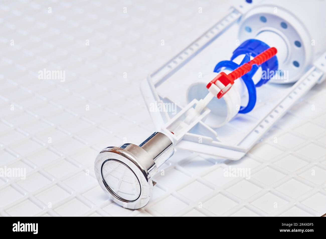 Plumbing. Toilet flush mechanism, siphon fittings on white checkered ...