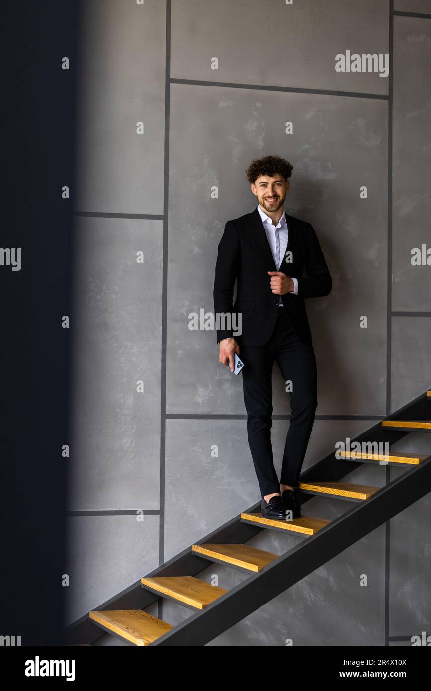 Business person stand stairs hi-res stock photography and images - Alamy