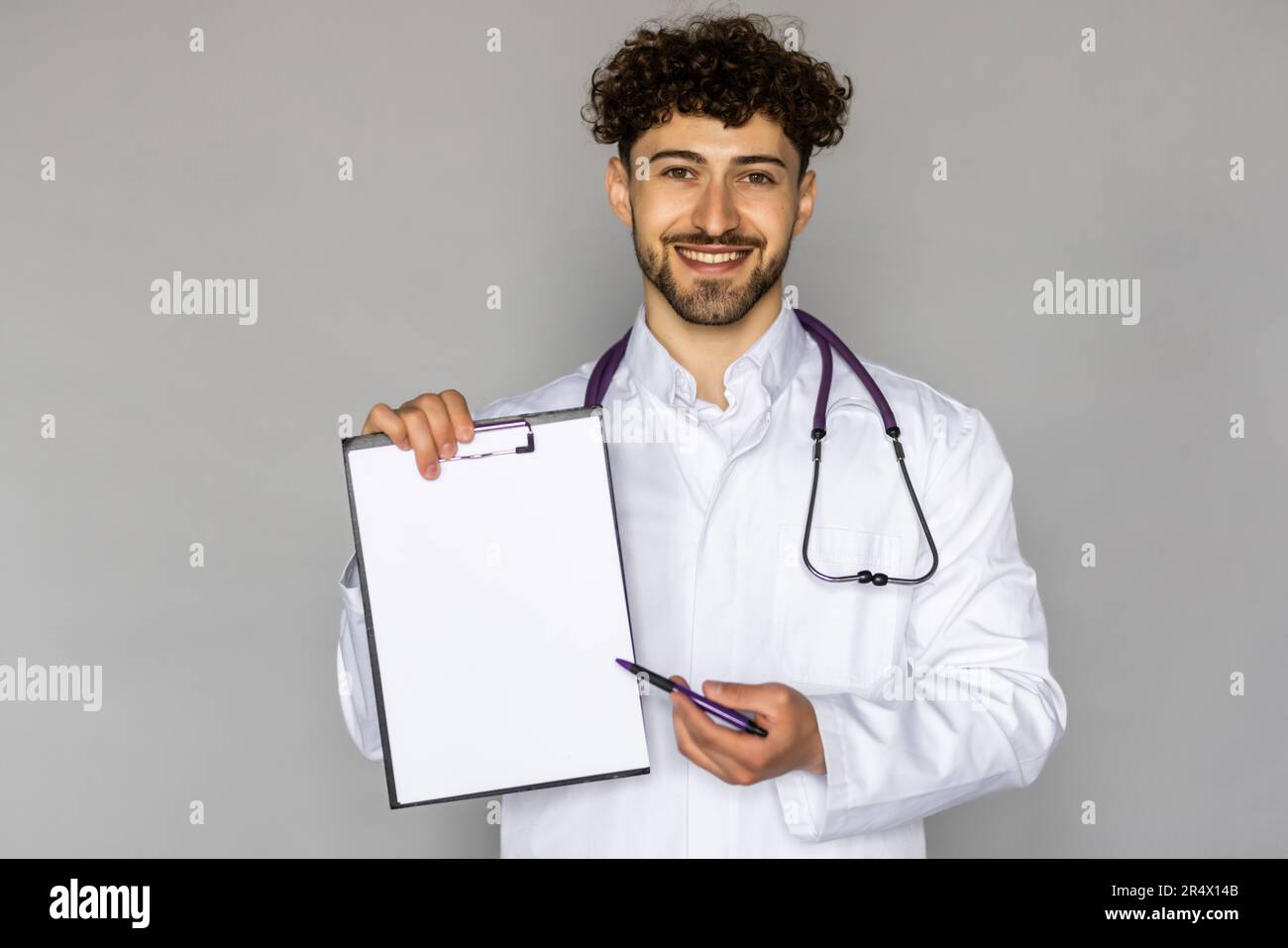 Doctor wears white medical gown suit work in hospital hold clipboard ...