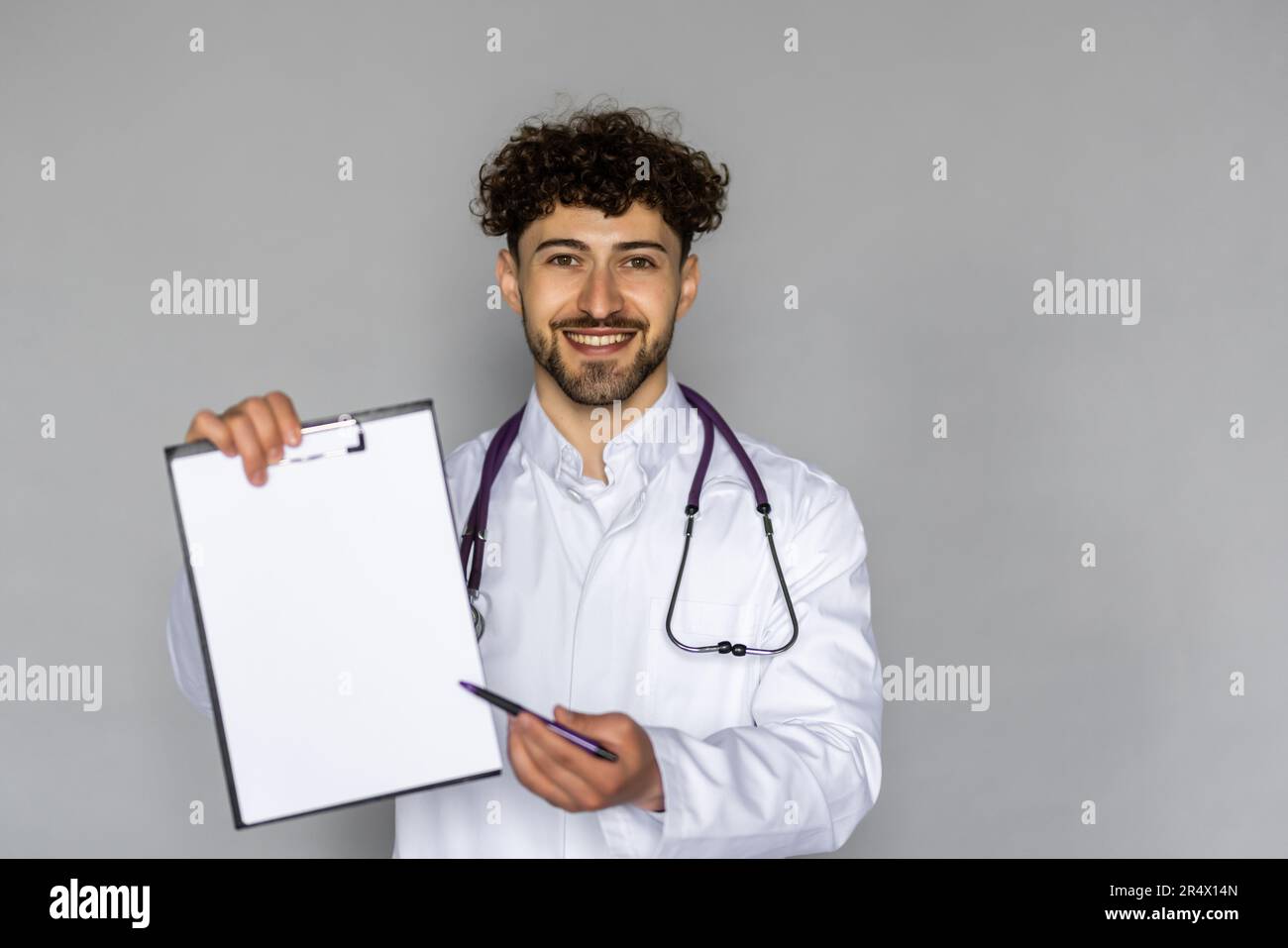 Doctor wears white medical gown suit work in hospital hold clipboard ...