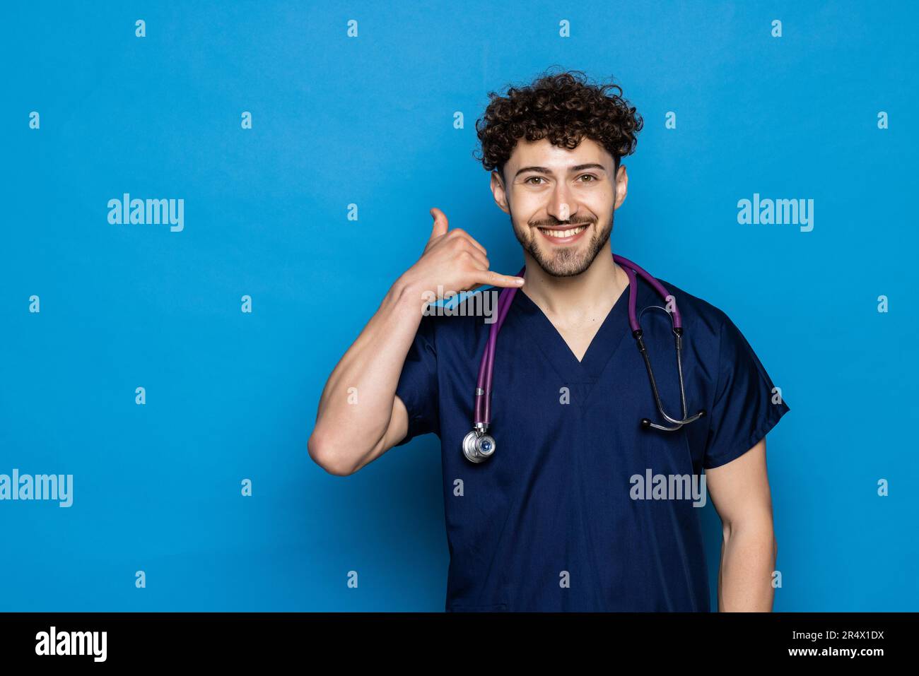 Handsome bald doctor man with beard wearing glasses and stethoscope ...