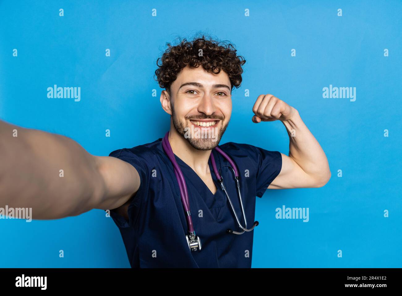 Self portrait of attractive cheerful man with stubble shooting selfie ...