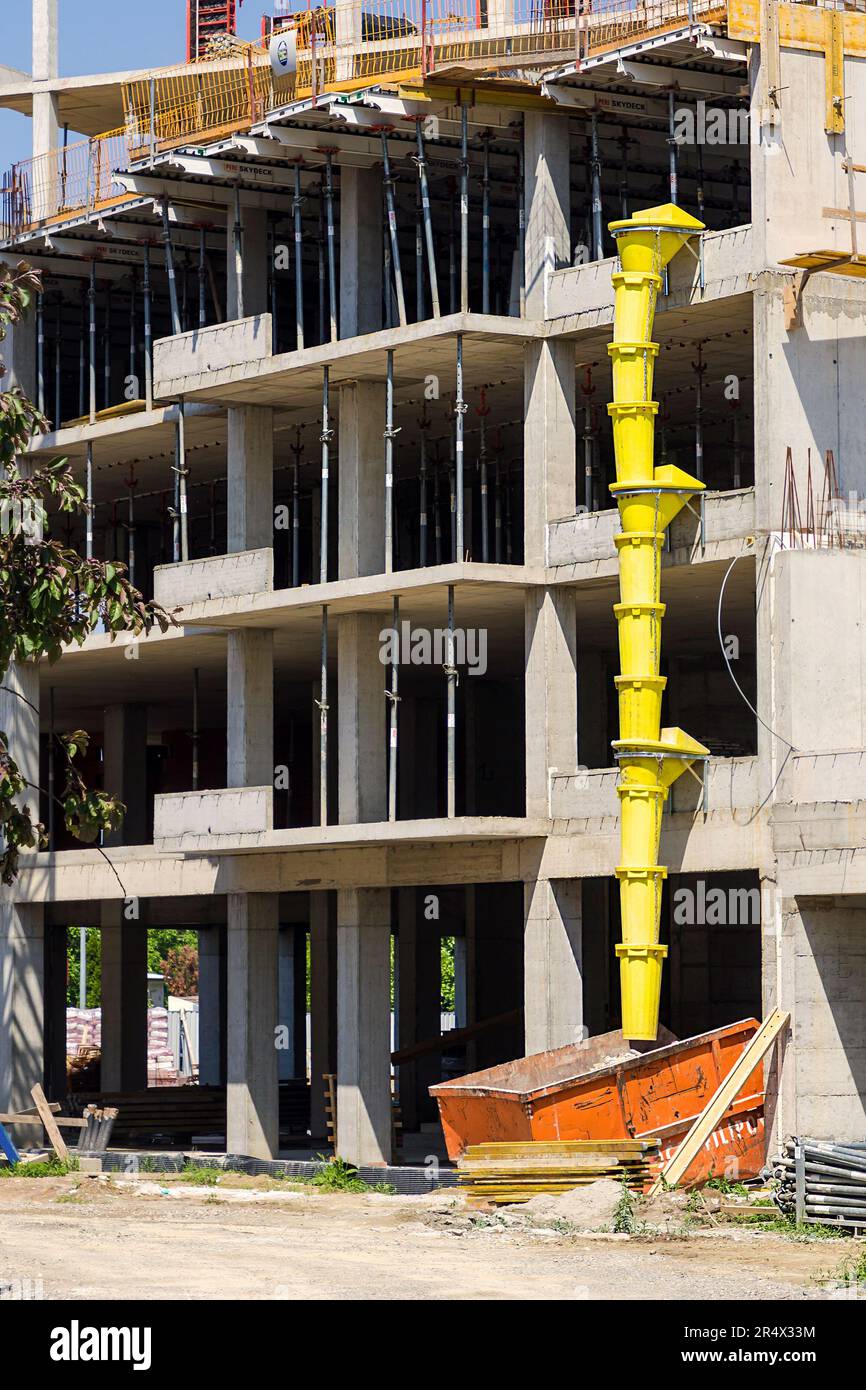 Construction site building with chute tube used for clearing large ...