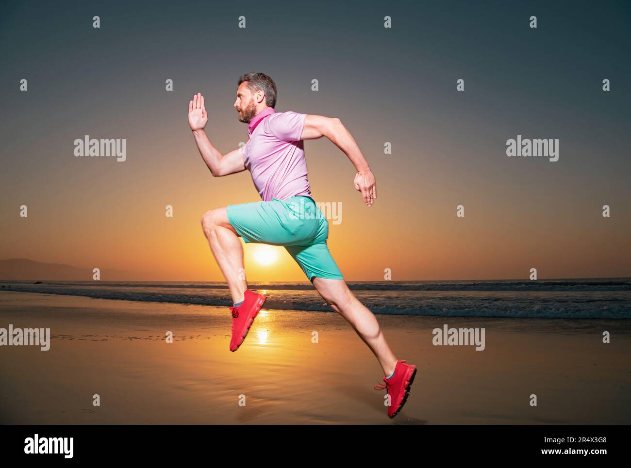 Athletic young man running in the nature. Fit man fitness model working ...