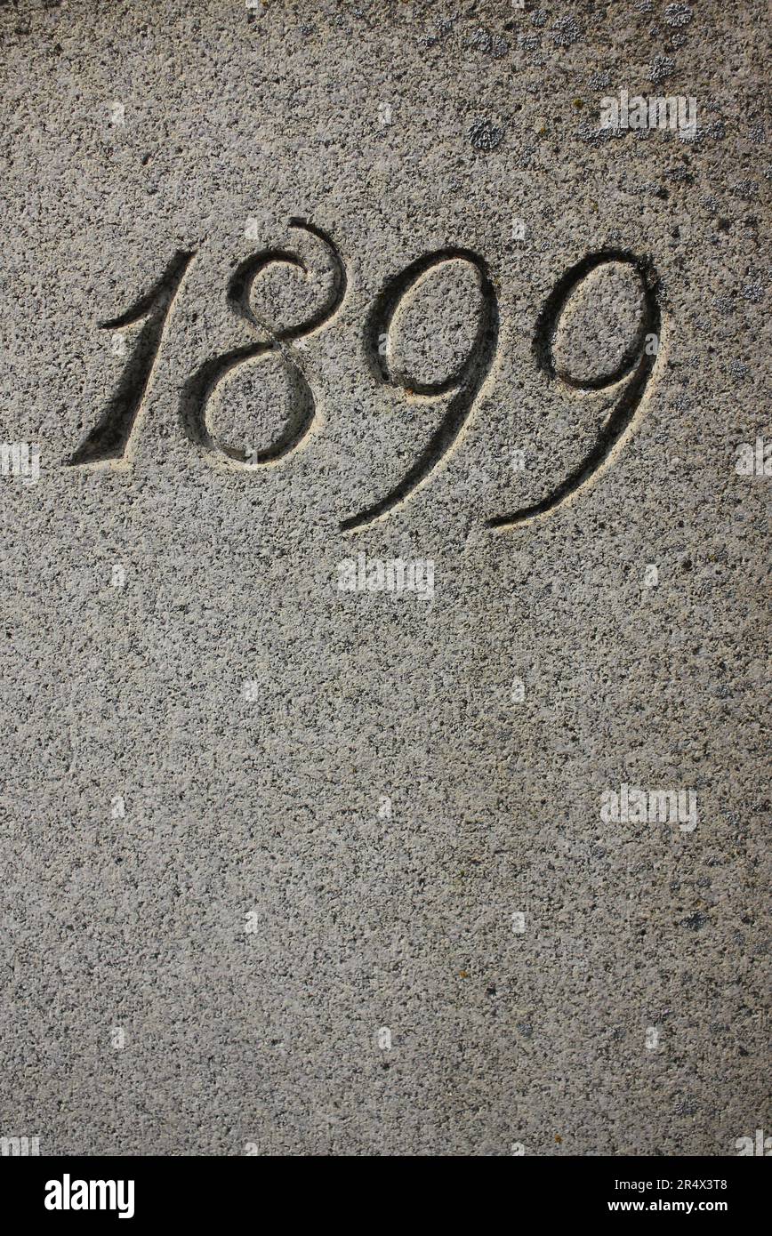 The year 1899 carved into stone with a beautiful dated script Stock ...