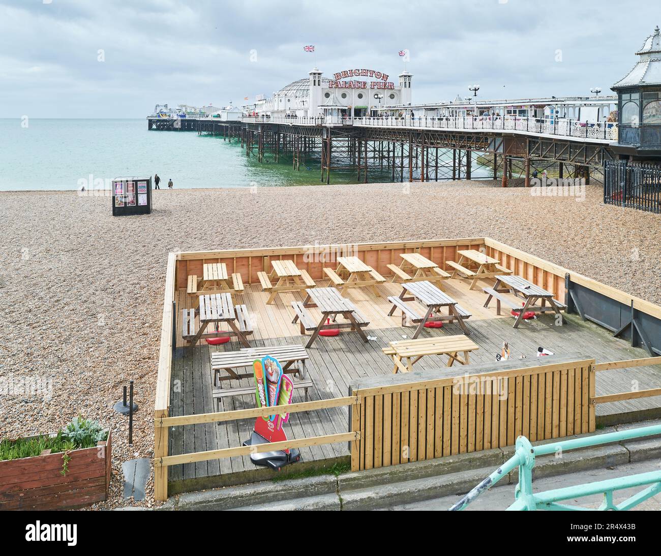 A deserted café on the beach next to Brighton pier, south coast of ...