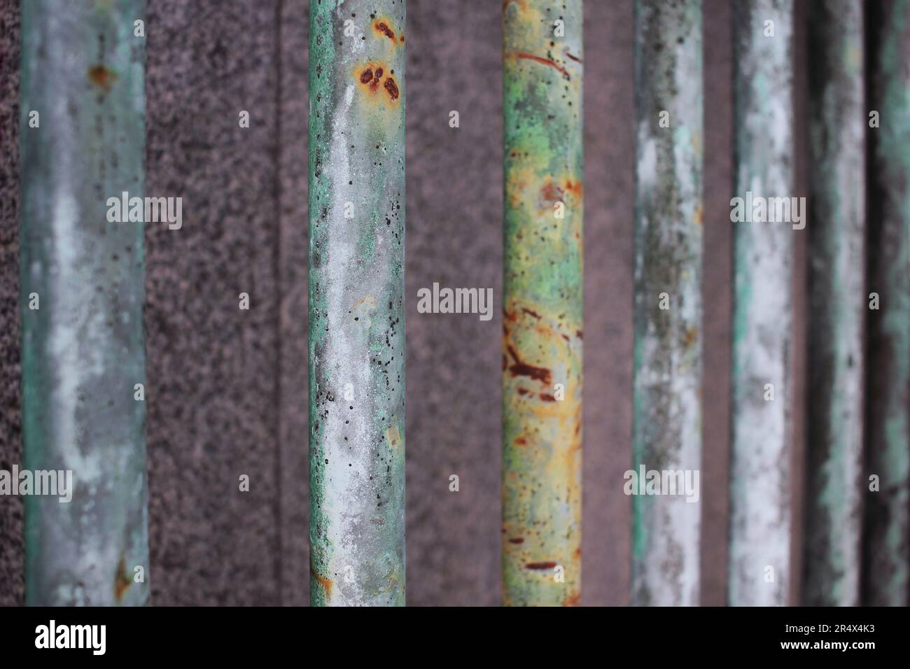 Vertical metal prison bars protecting the room inside Stock Photo - Alamy