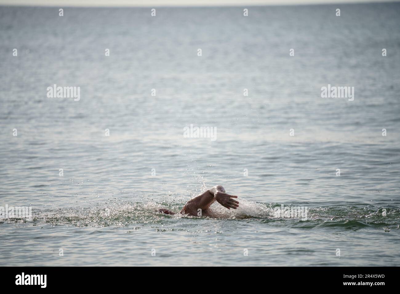 Bald man swimming hi-res stock photography and images - Alamy