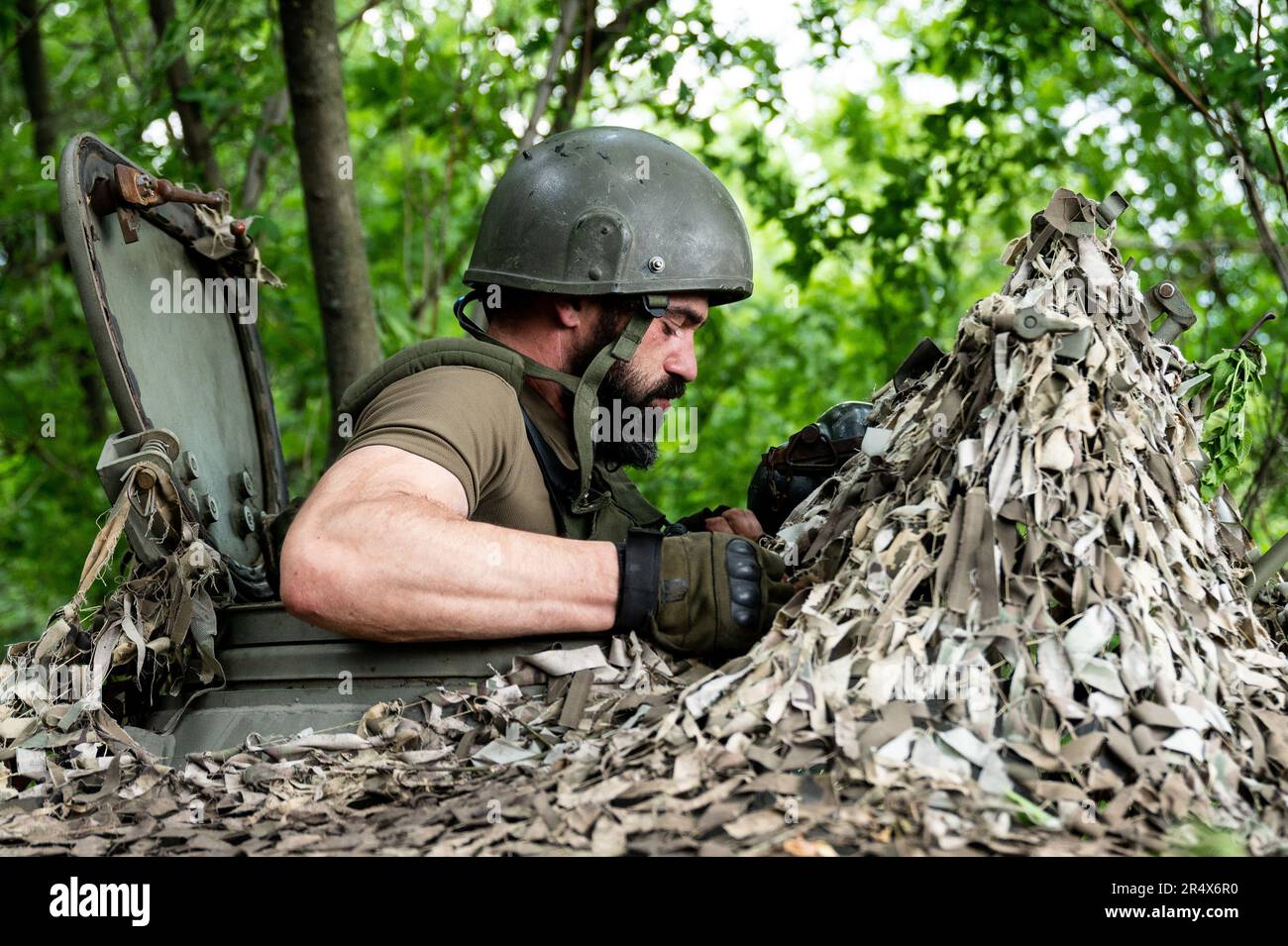 Ukraine. 29th May, 2023. Howitzer team member inside a self propelled ...