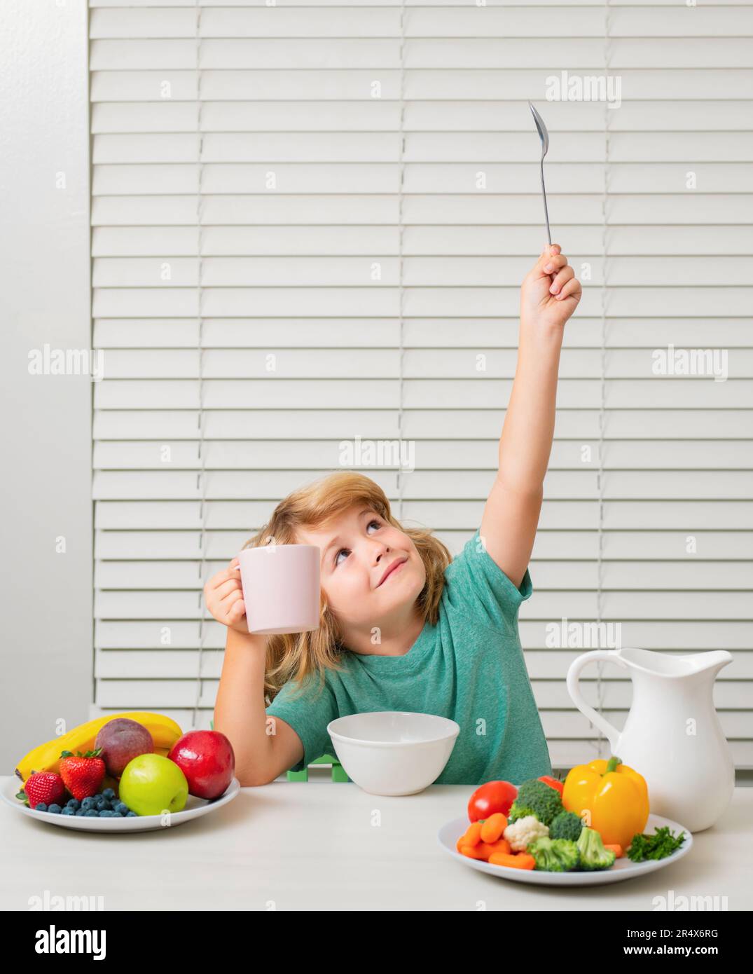 Little child boy having healthy breakfast. Kids nutrition and ...