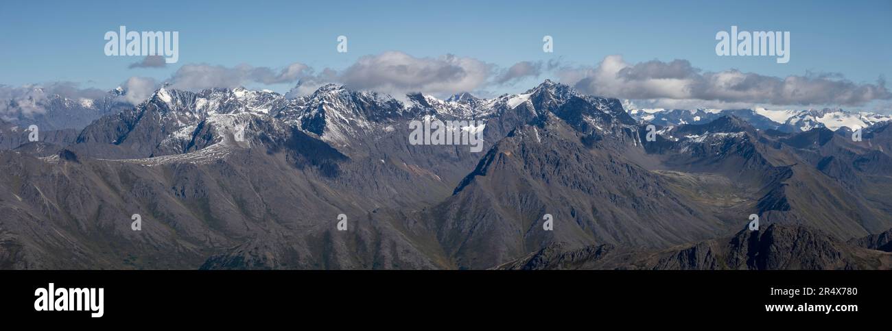 Scenic overview of the grey, snow-capped peaks of the Chugach Mountain ...