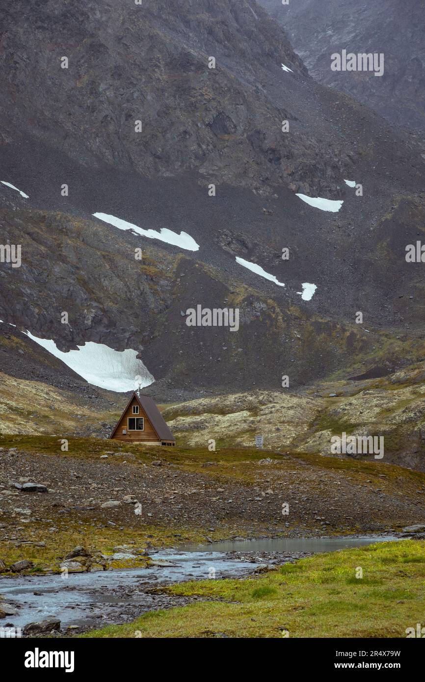 A-Frame cabin along the historic Iditarod Trail at Crow Pass in the ...