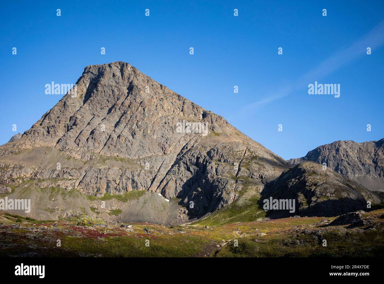 Close-up view of Williwaw Peak against a bright, blue sky in the ...