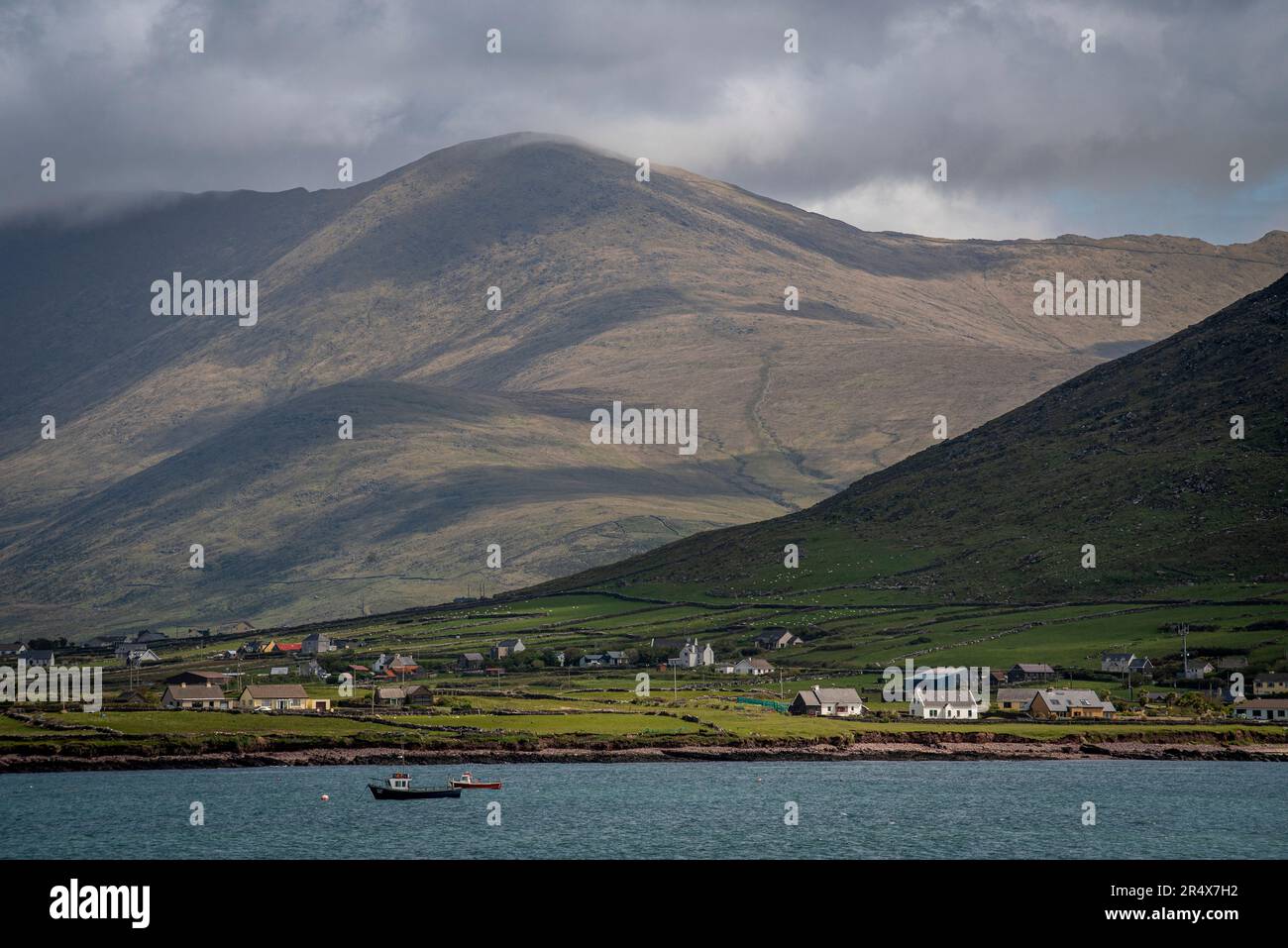 View of the village of Murreagh and shoreline across Ballyferriter Bay ...